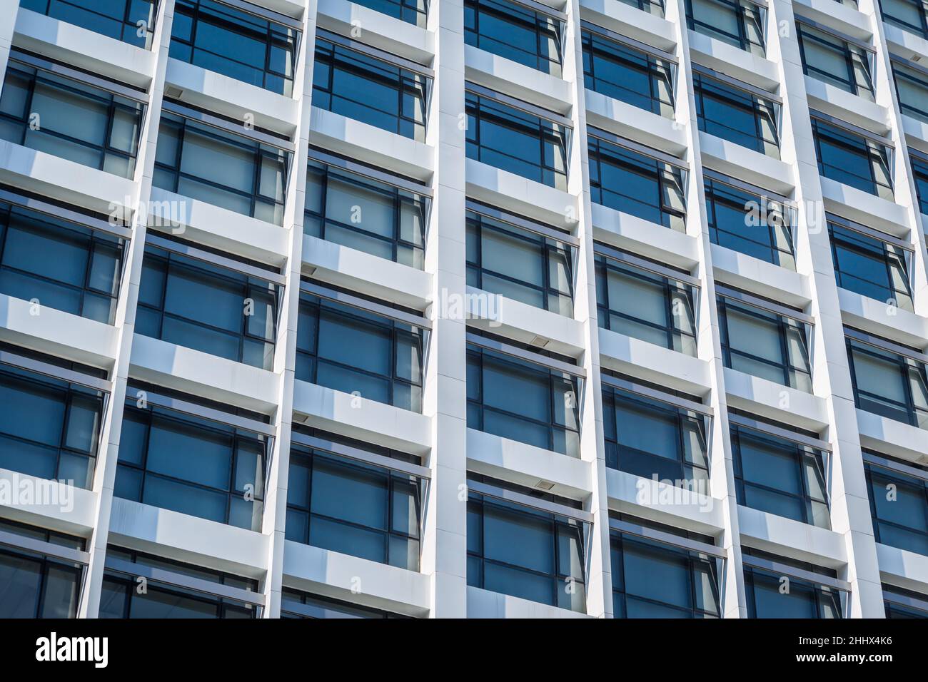 Windows of white building background Stock Photo - Alamy