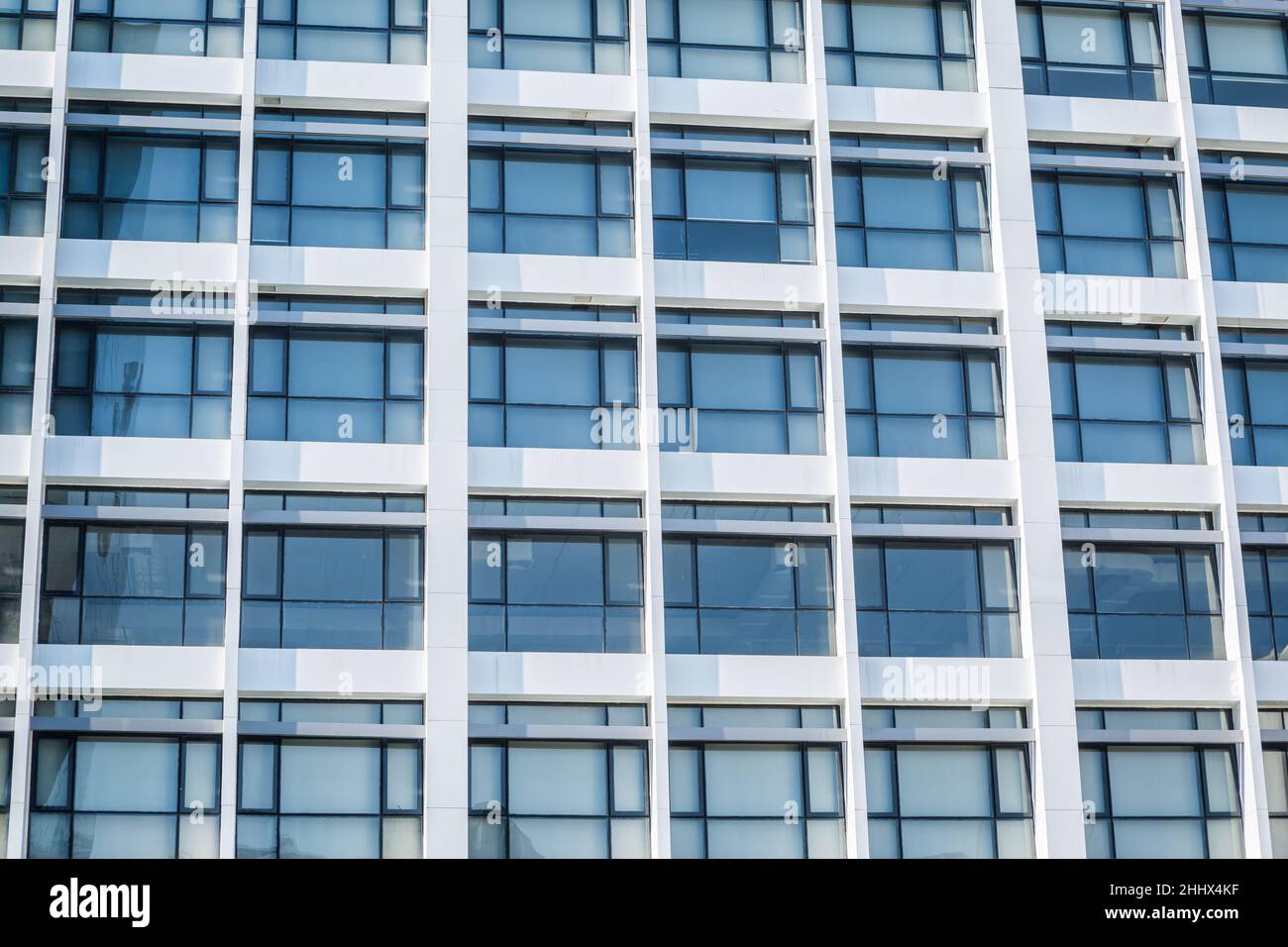 Windows of white building background Stock Photo - Alamy
