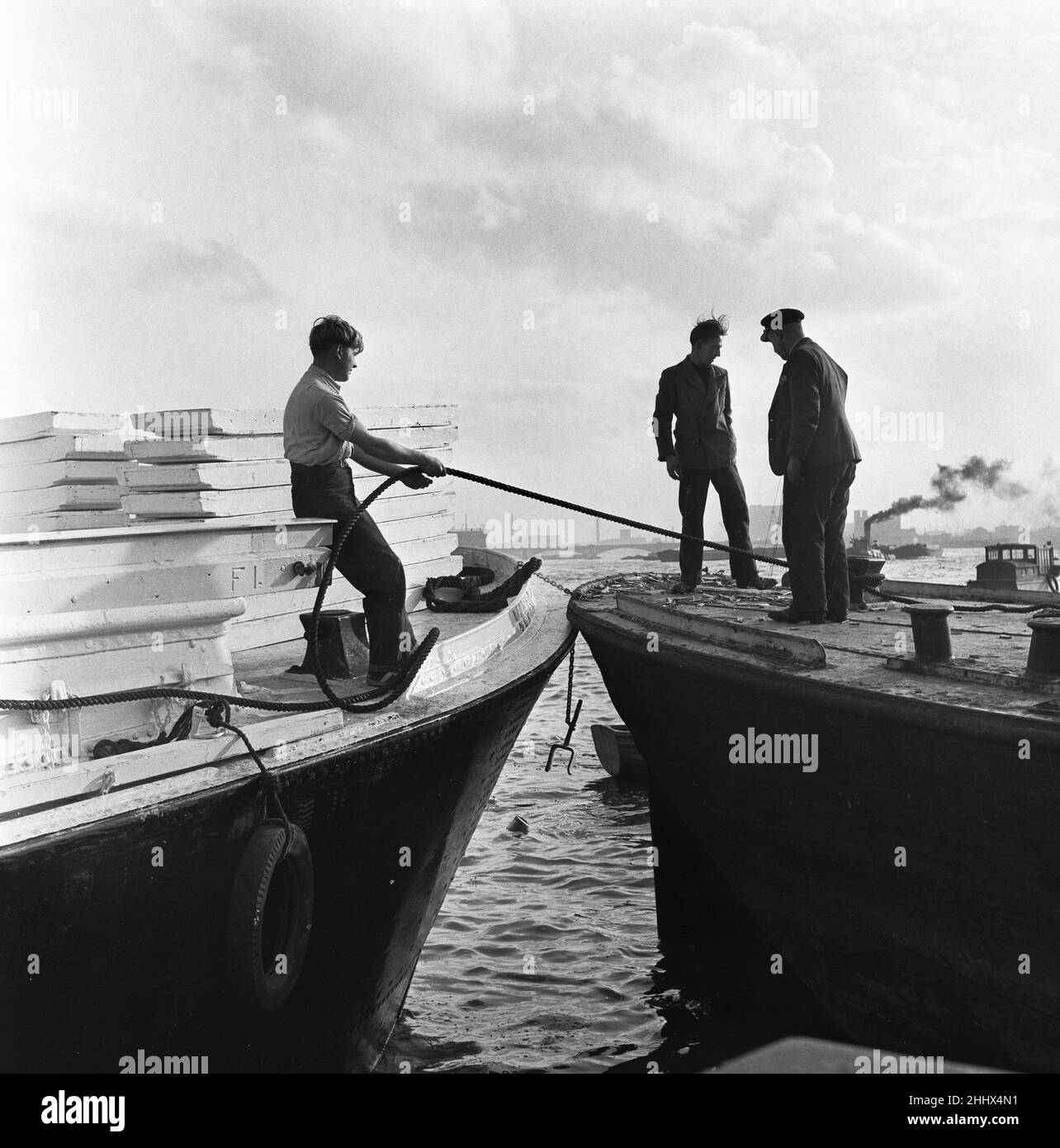 Bargemen at work Chelsea Reach on the River Thames close to the Chelsea ...