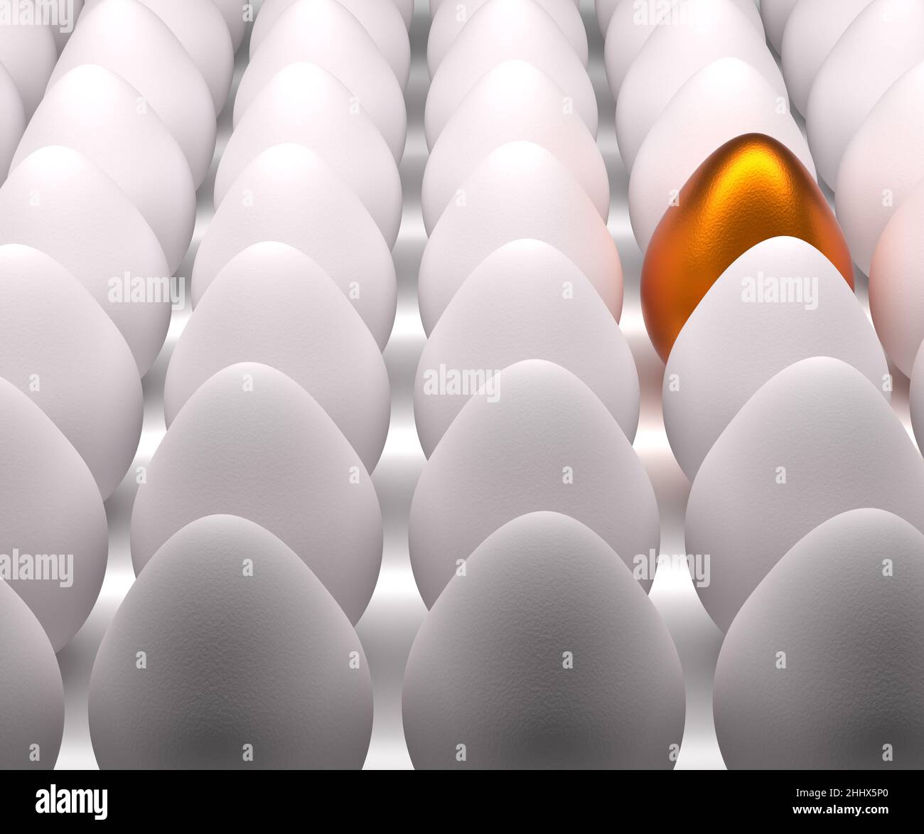 One golden Easter egg with many natural white eggs on a studio ...