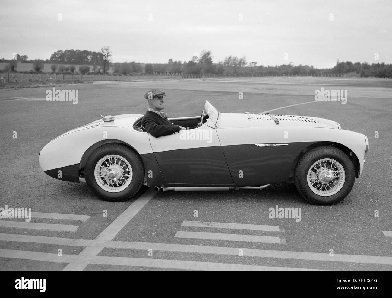 Daily Herald motor racing correspondent Thomas H Wisdom sitting at the ...