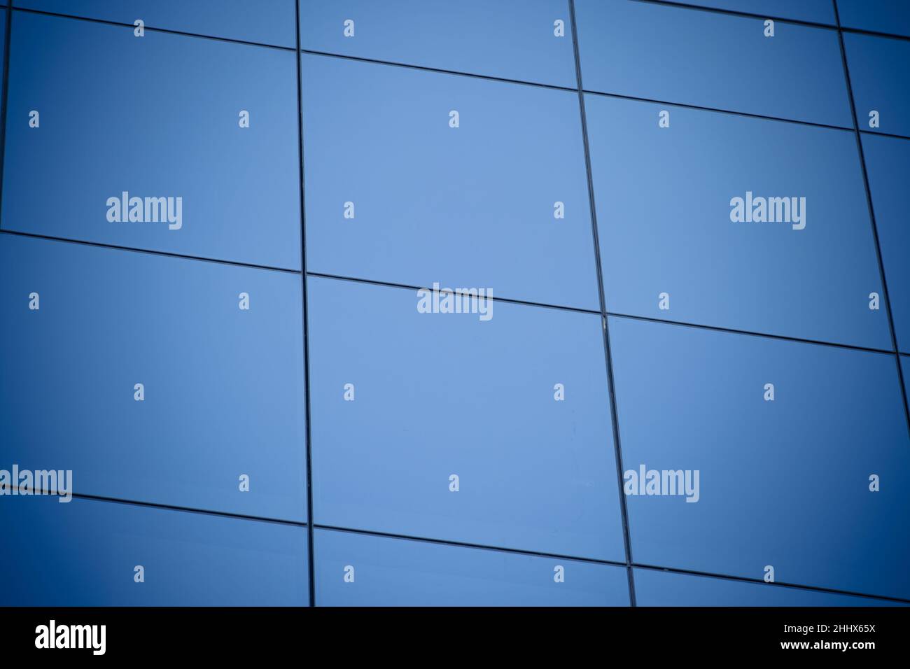 Modern office building with blue glass windows background Stock Photo ...