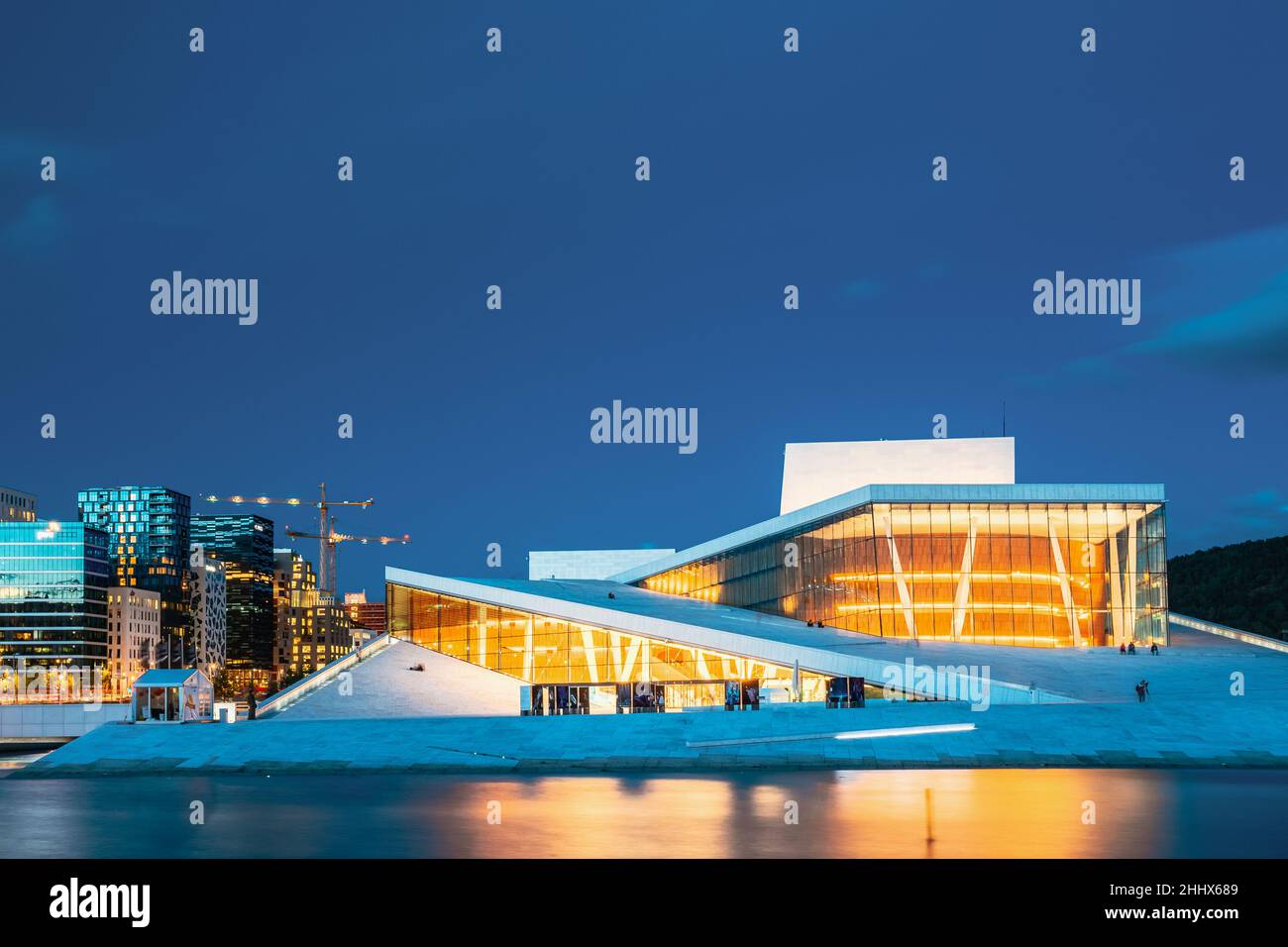 Oslo Norway. Evening View Of Illuminated Opera Ballet House Among High ...