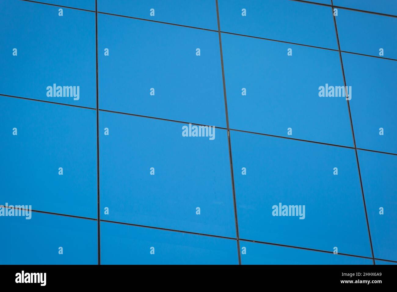 Modern office building with blue glass windows background Stock Photo ...