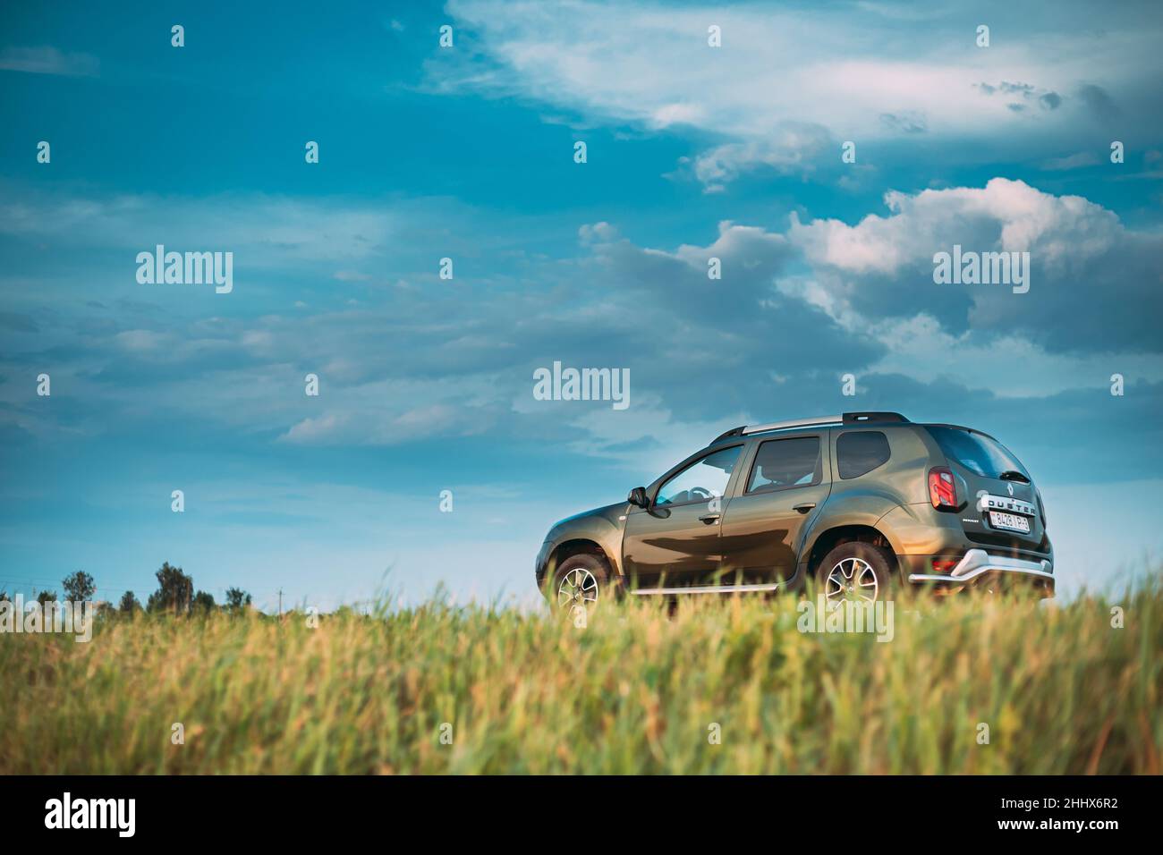 Green Car Renault Duster Suv Parked On Field Country Road Stock Photo ...