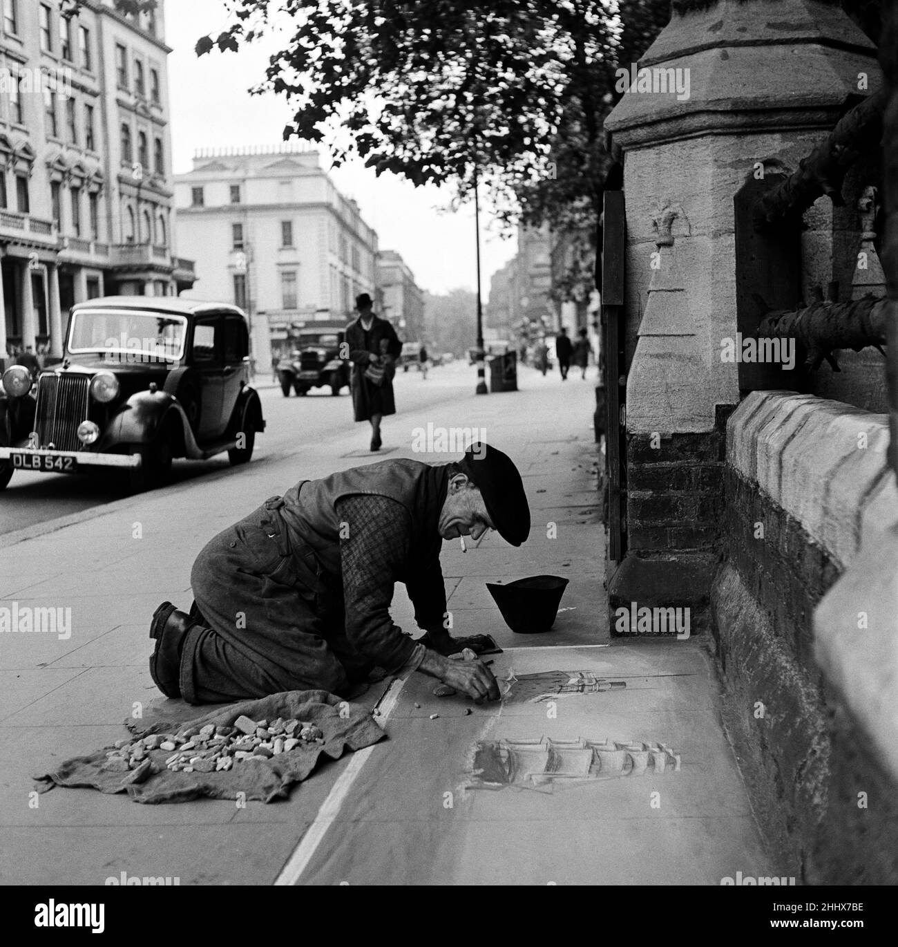 Pavement Artist at work in Gloucester Road, London, 1946 Stock Photo ...