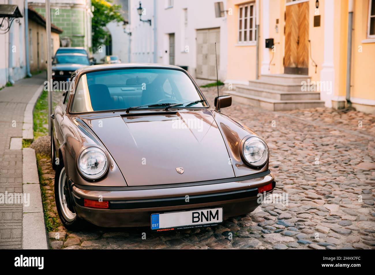 Front View Of Porsche 930 Car Parked In Old Narrow Street Stock Photo ...