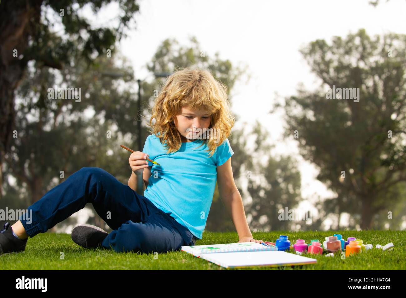 Children draw paint pictures outside, childrens creativity. Kids ...