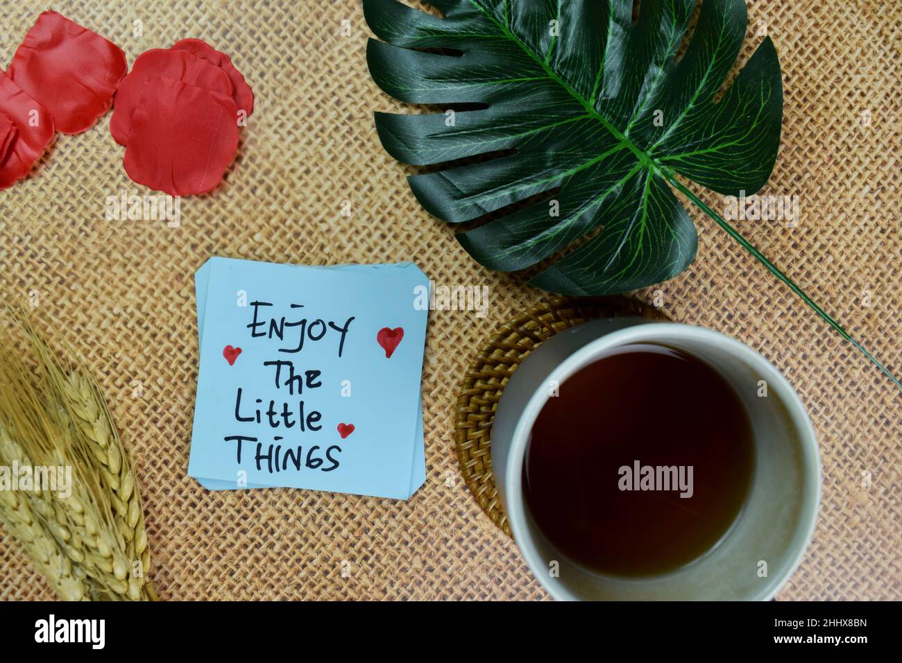 Enjoy The Little Things write on sticky notes isolated on Wooden Table ...