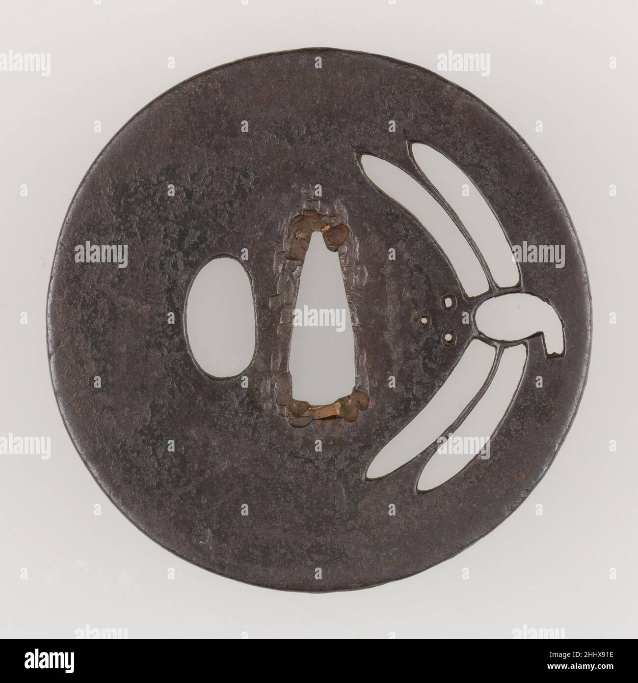 Sword Guard (Tsuba) 16th century Japanese This tsuba features an ...