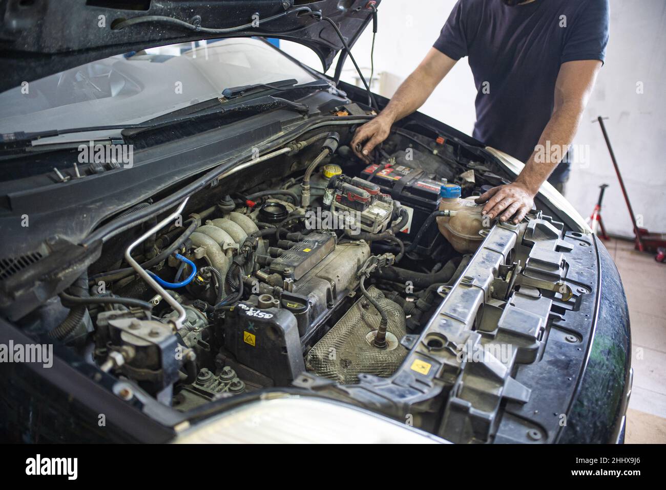 Male working car engine transportation automotive repairs hi-res stock ...