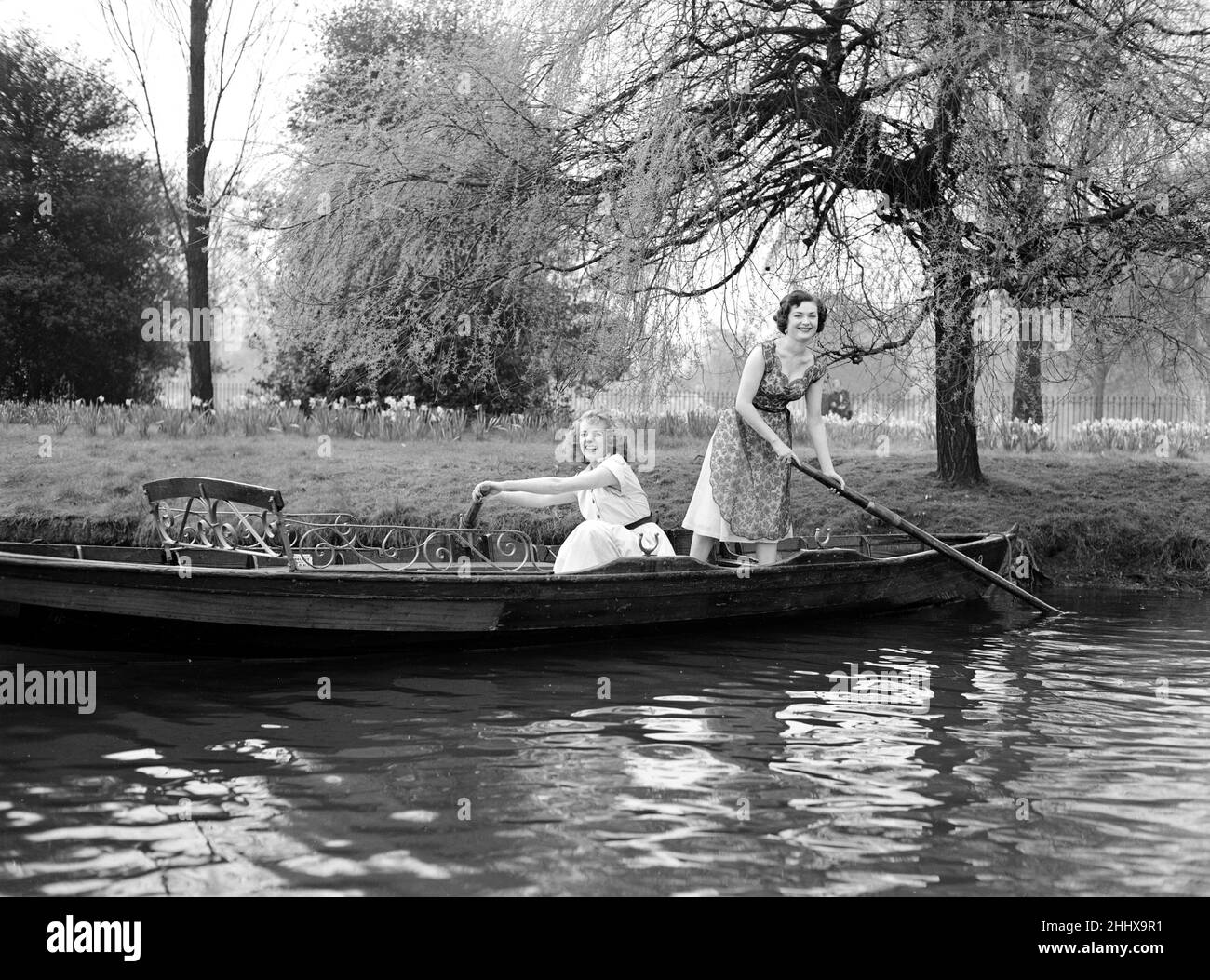 Two girls in a rowing boat on a trip on the river Circa 1954 Stock ...