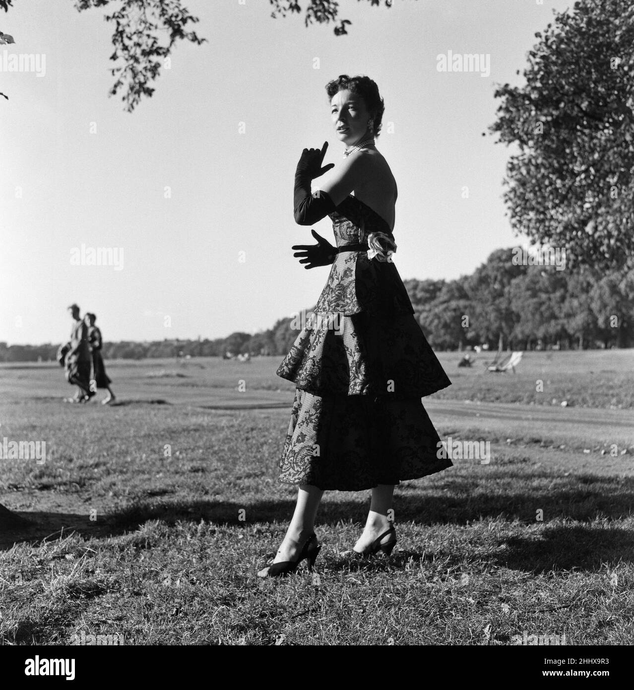 A model wearing Norman Hartnell autumn collection. Hyde Park, London ...