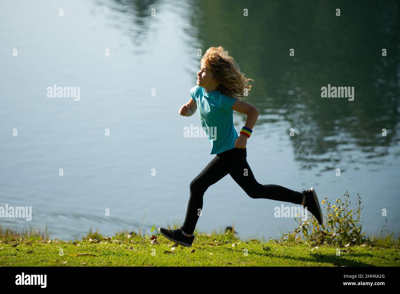 Kids running outdoors. Child runner jogger running in the nature ...