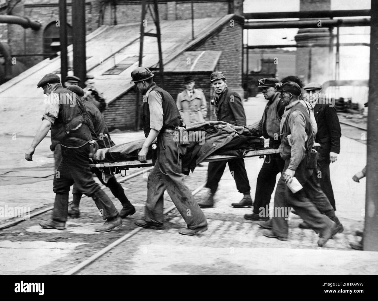 Grim scene, rescuers carry out an injured miner after the Easington ...
