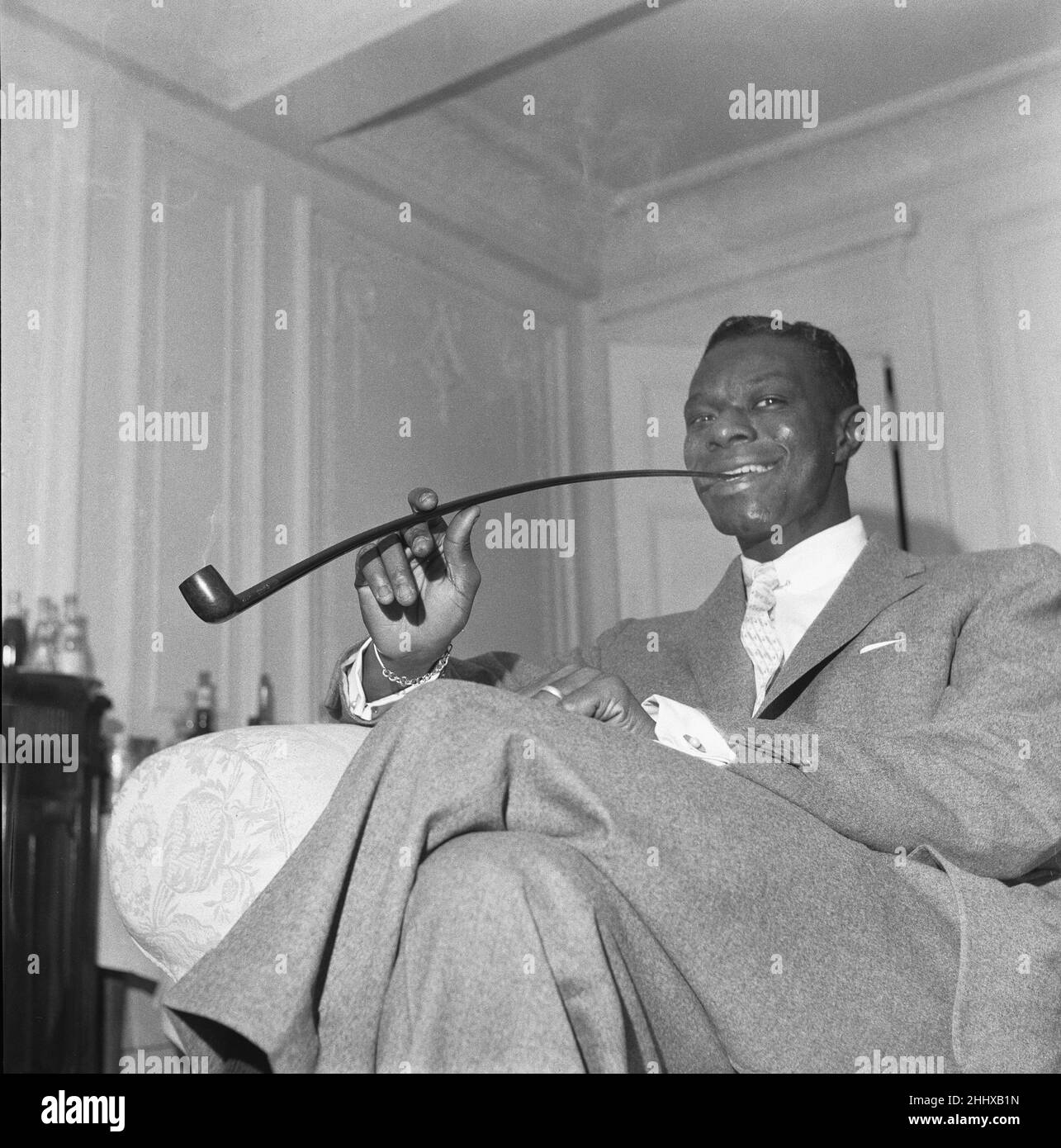 Singer and pipe collector Nat King Cole seen here with his Church ...