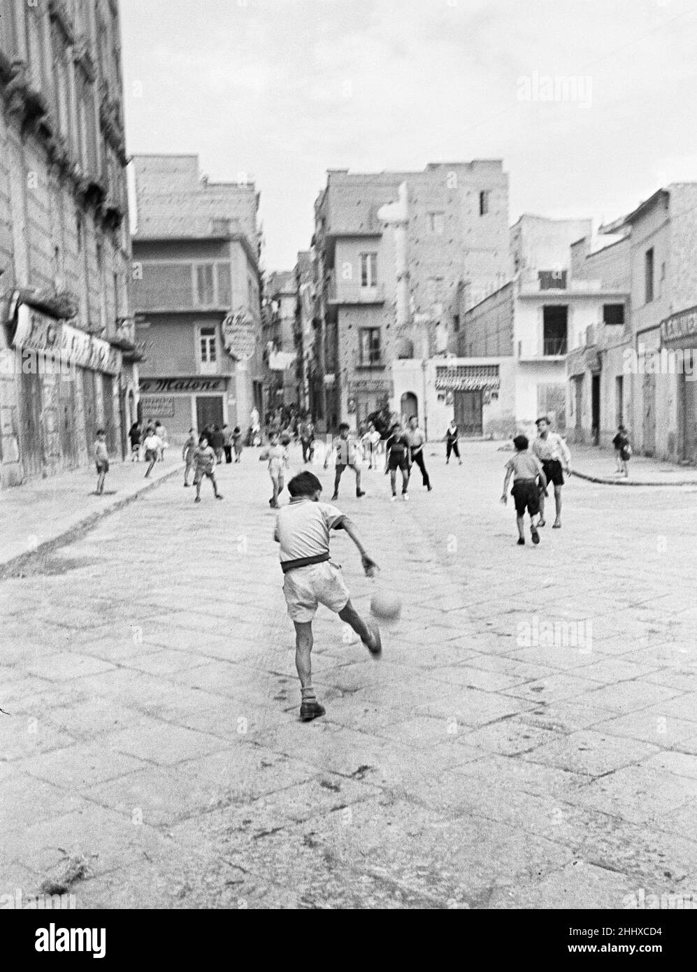 Scenes in Naples, southern Italy showing young boys enjoying a game of ...