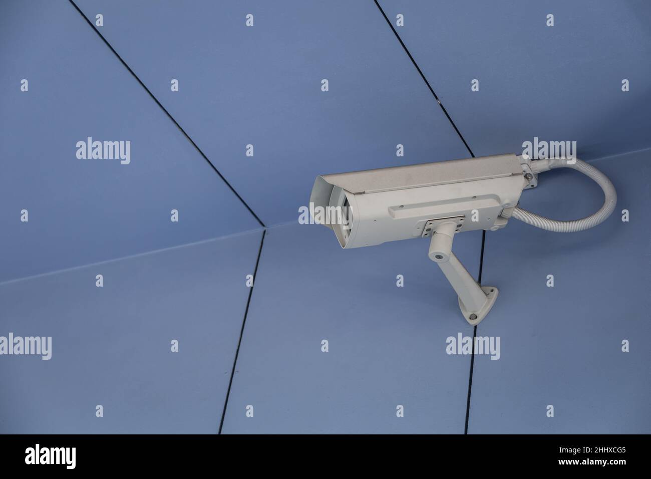 Security CCTV camera in office building background Stock Photo - Alamy