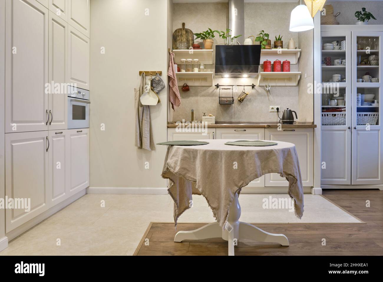 Modern new kitchen with a round dining table in the living room ...
