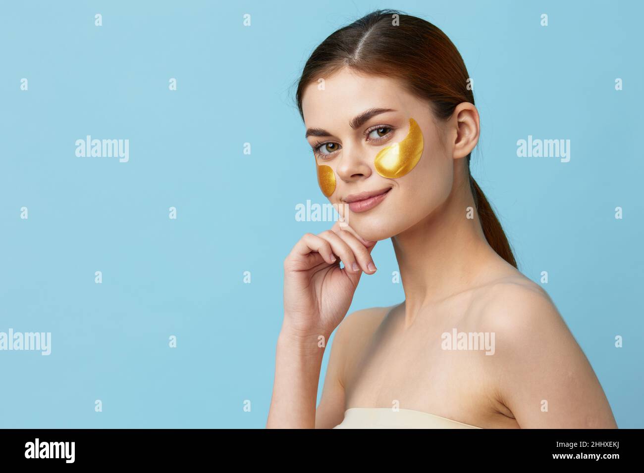 young woman patches rejuvenation skin care fun after shower close-up ...