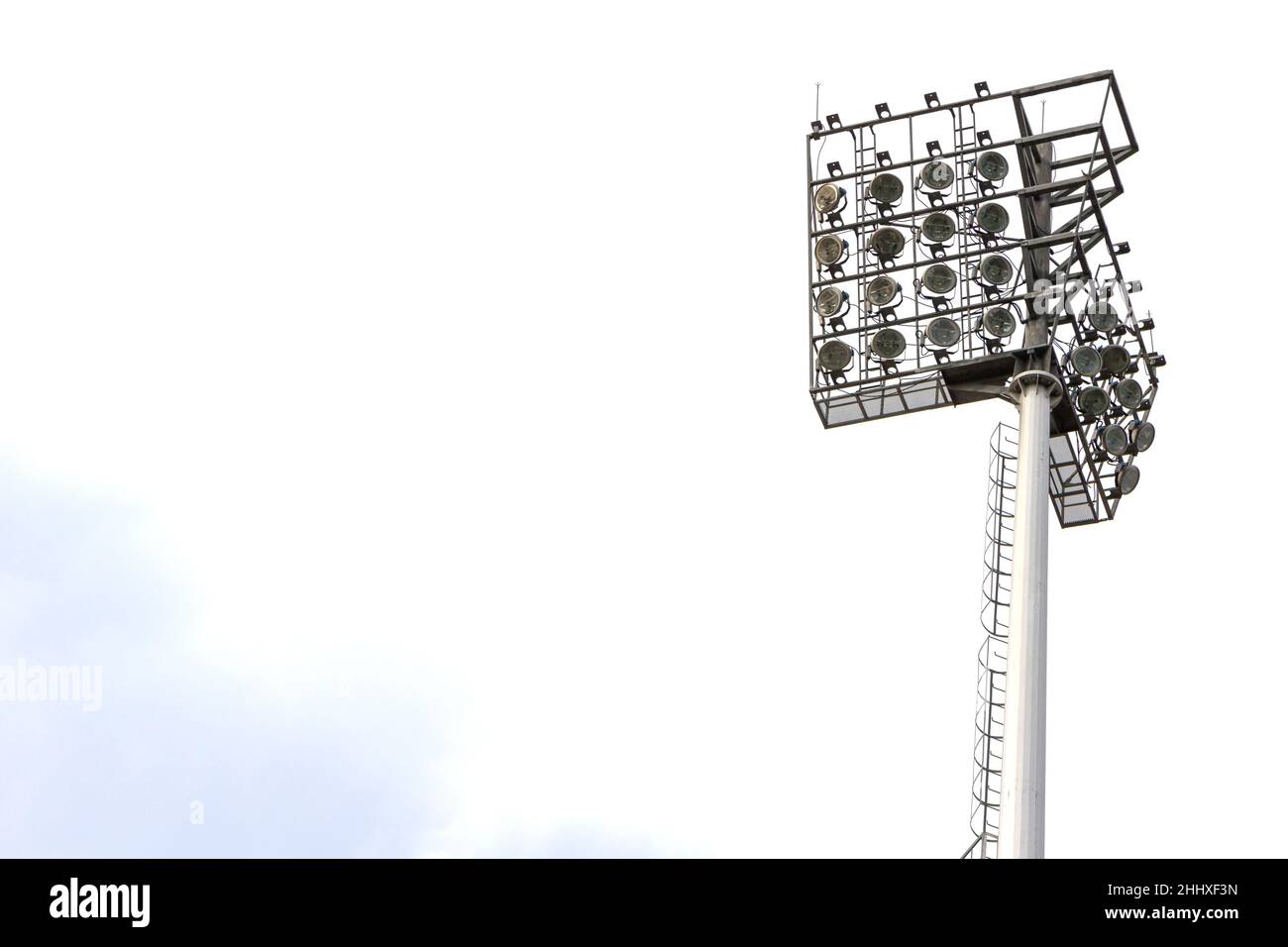 Spotlight on lighting tower of stadium background Stock Photo - Alamy