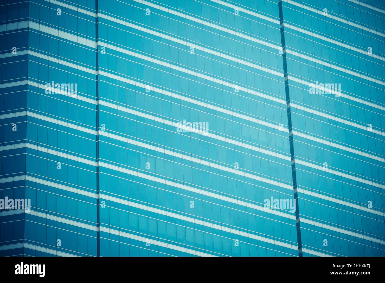 Modern office building with blue glass windows background Stock Photo ...