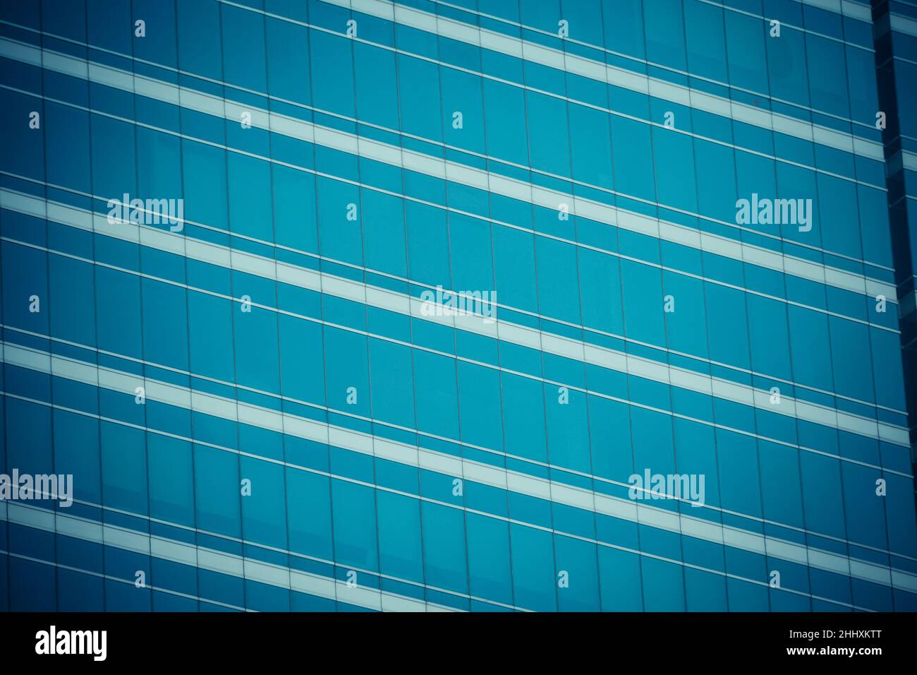 Modern office building with blue glass windows background Stock Photo ...