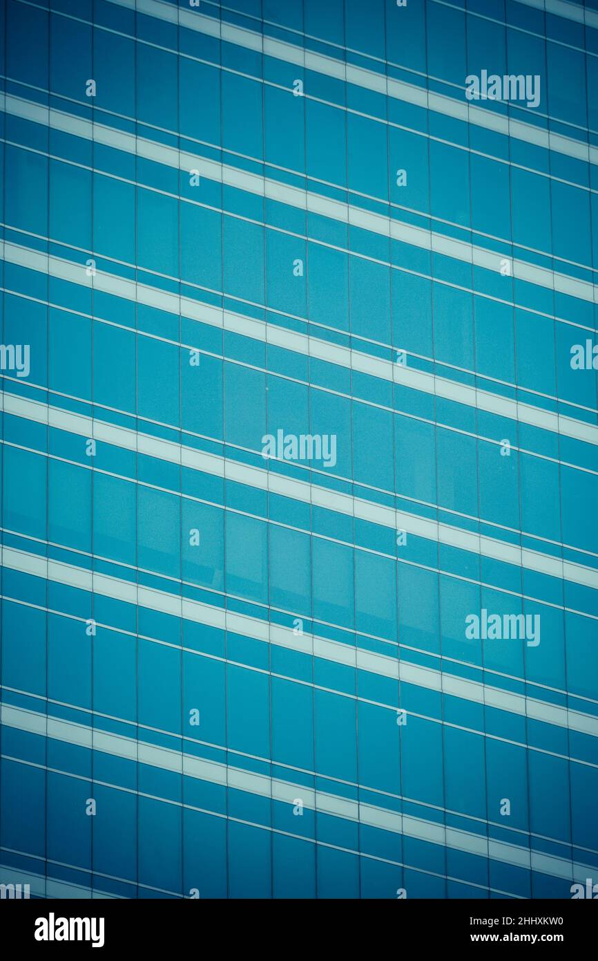 Modern office building with blue glass windows background Stock Photo ...