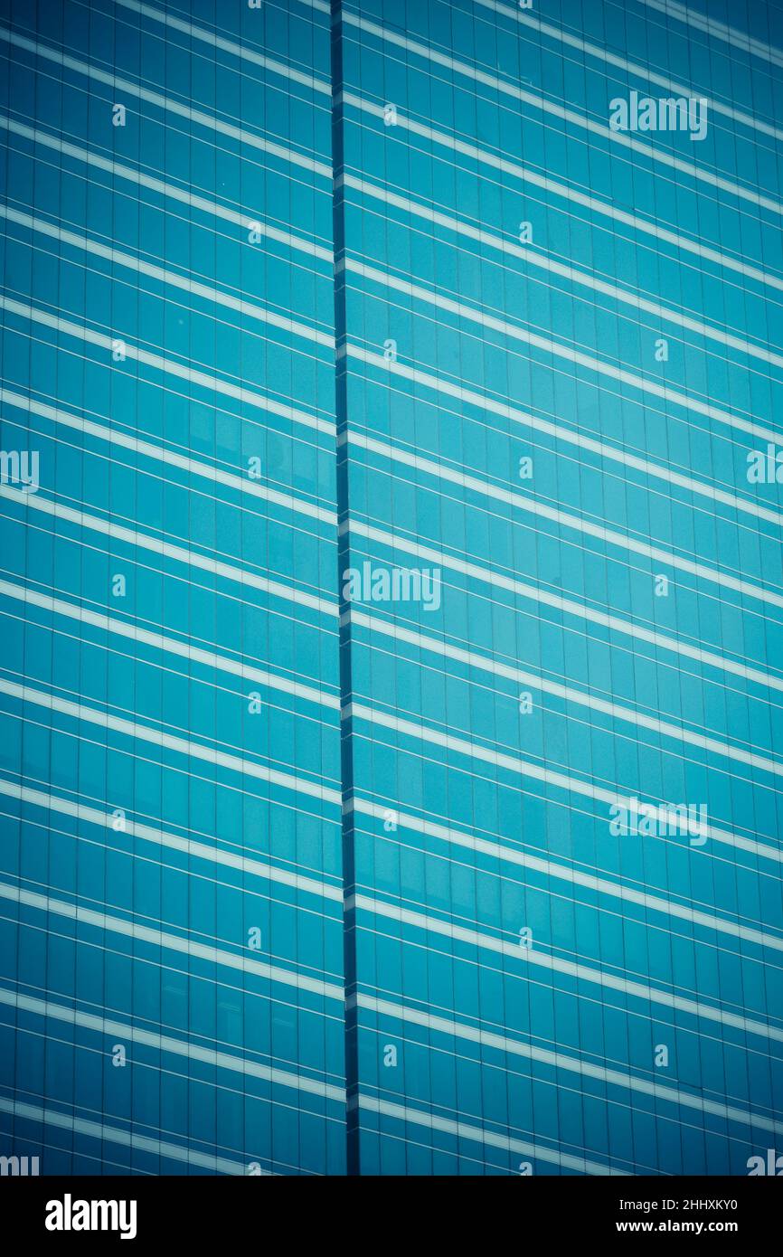 Modern office building with blue glass windows background Stock Photo ...