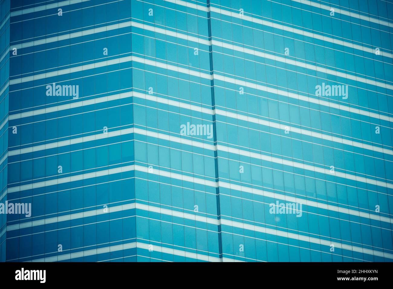 Modern office building with blue glass windows background Stock Photo ...