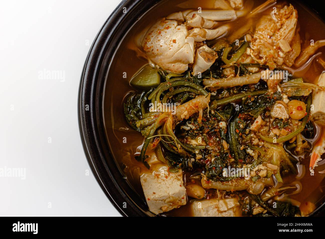 Soybean paste stew with shepherd's purse and crab on a white background ...
