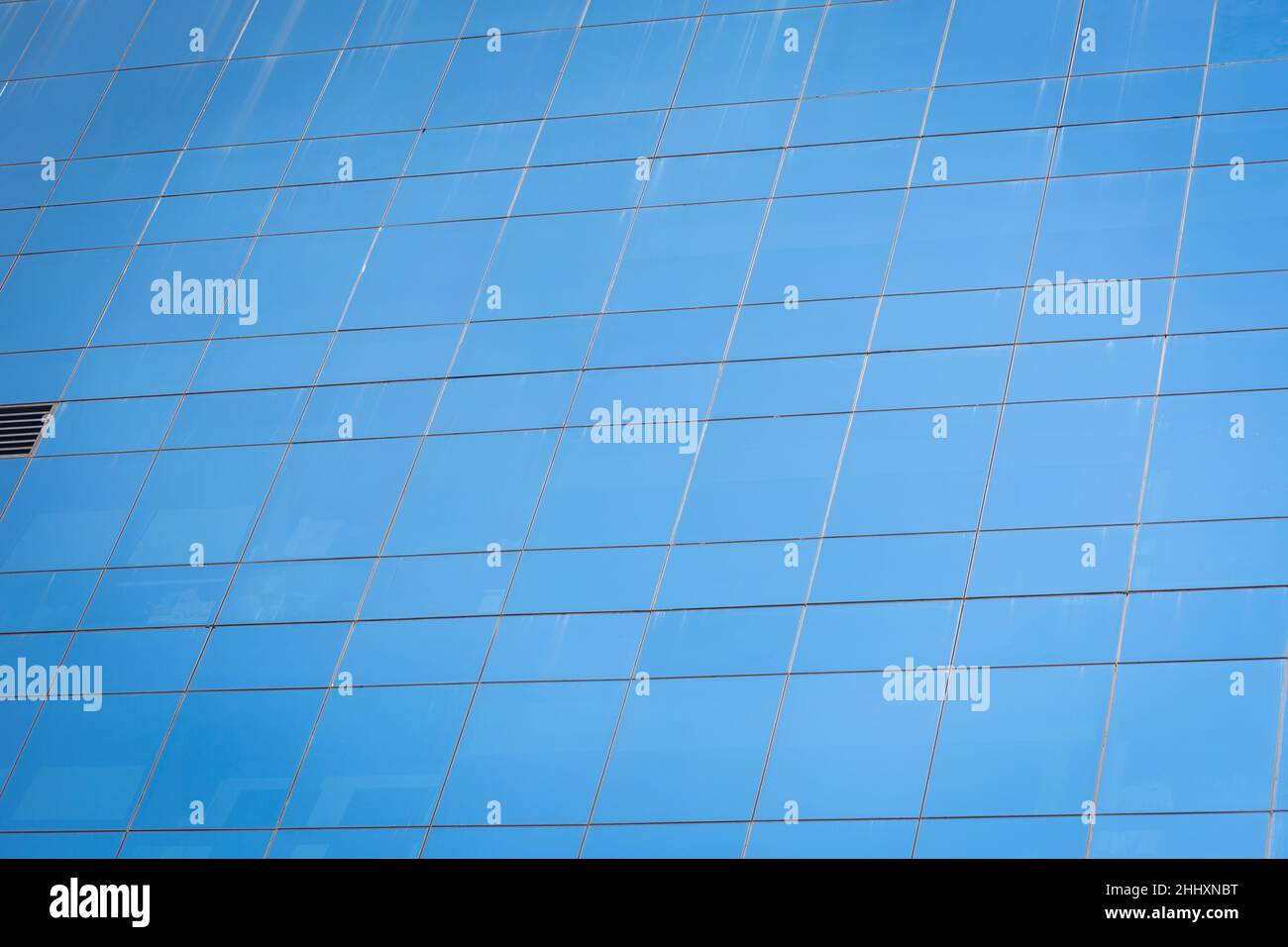 Modern office building with blue glass windows background Stock Photo ...