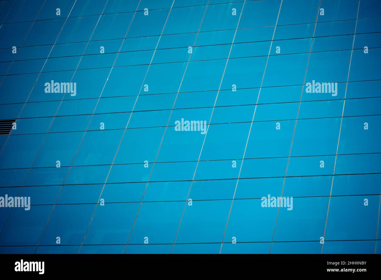 Modern office building with blue glass windows background Stock Photo ...