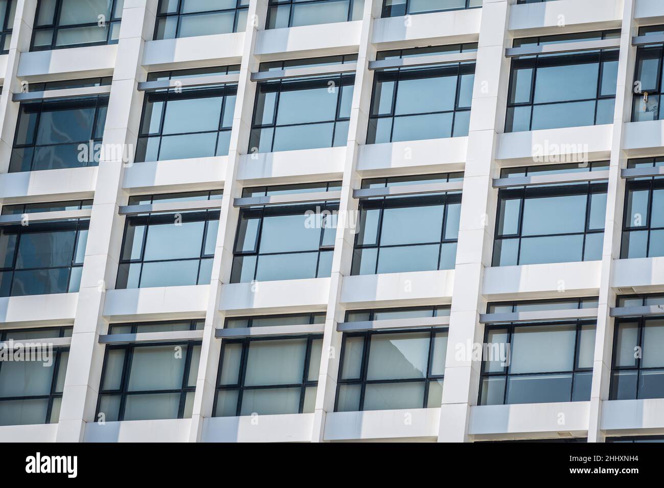 Windows of white building background Stock Photo - Alamy