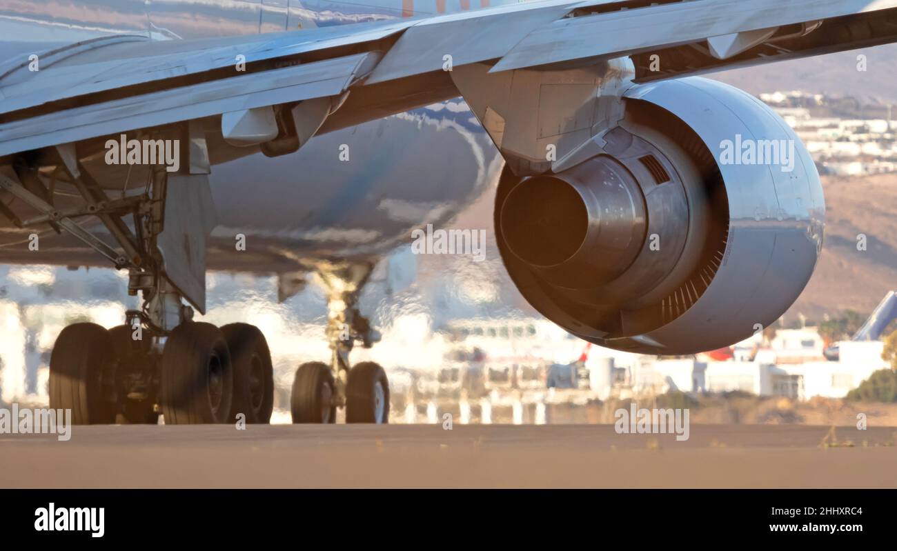 Hot air from jet engine against airplane taxiing to airport runway ...