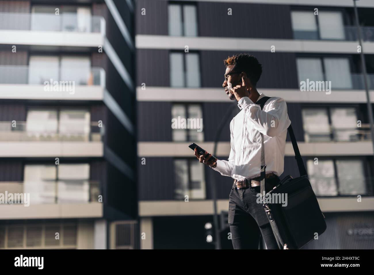 Man receiving smartphone call typing hi-res stock photography and ...