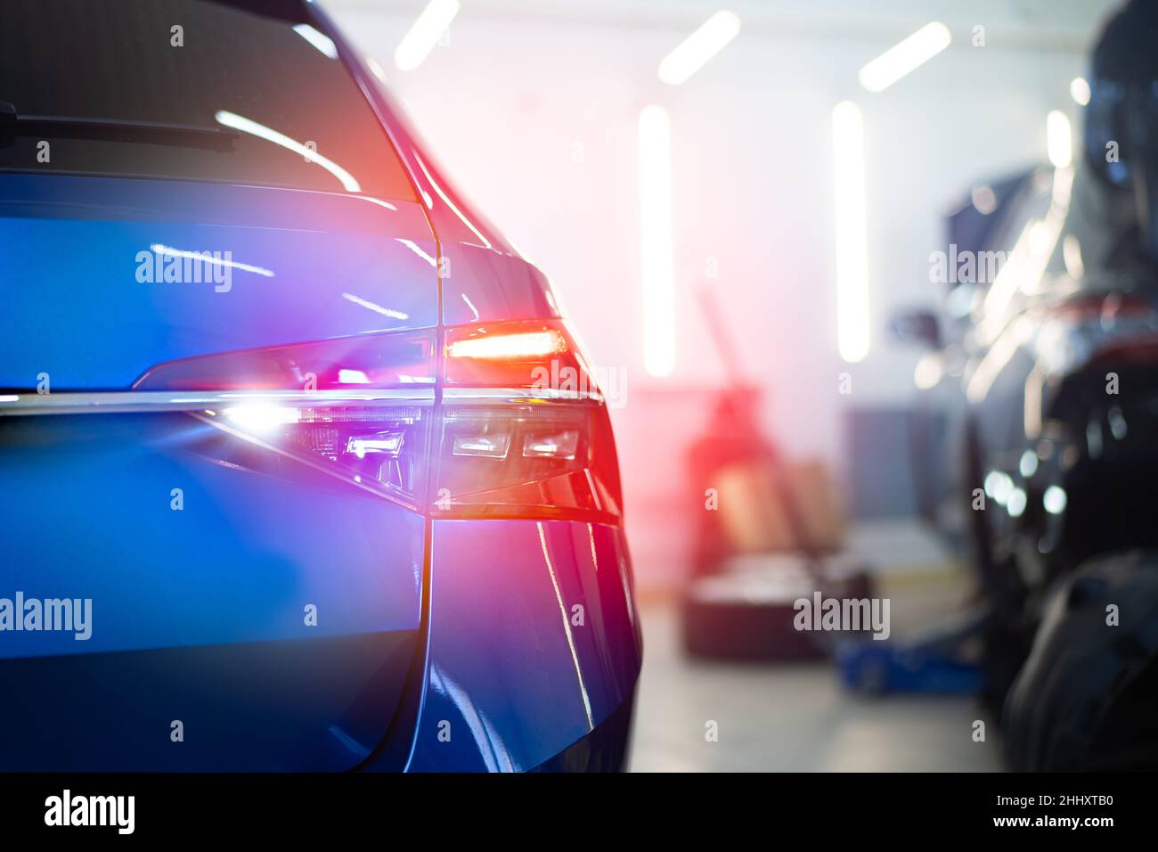 Back light view of new blue car Stock Photo - Alamy