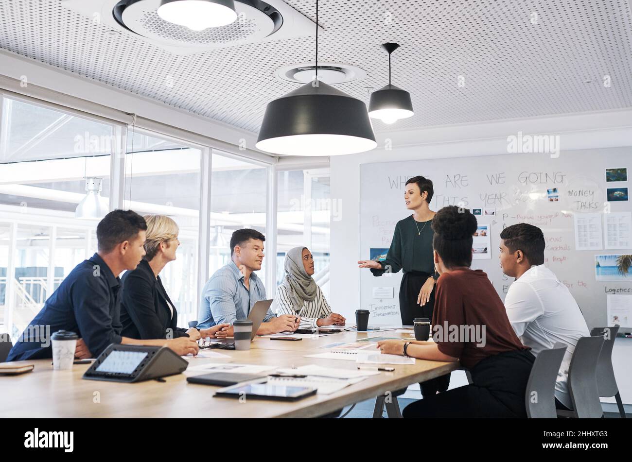 Dynamic team meeting in modern hi-res stock photography and images - Alamy