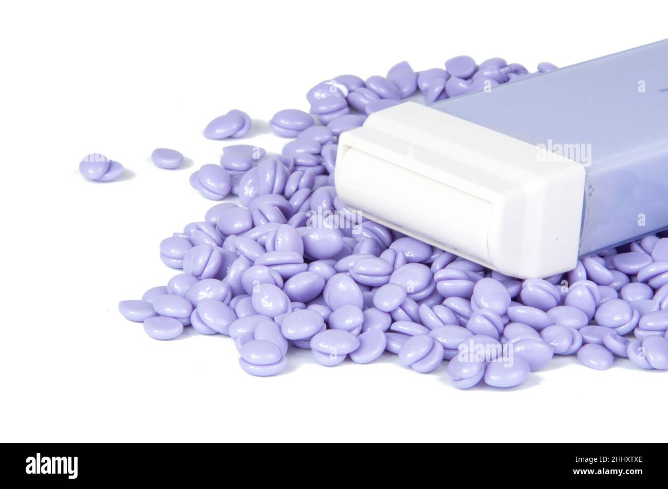 Violet wax drops and lavender for waxing depilation isolated on the ...