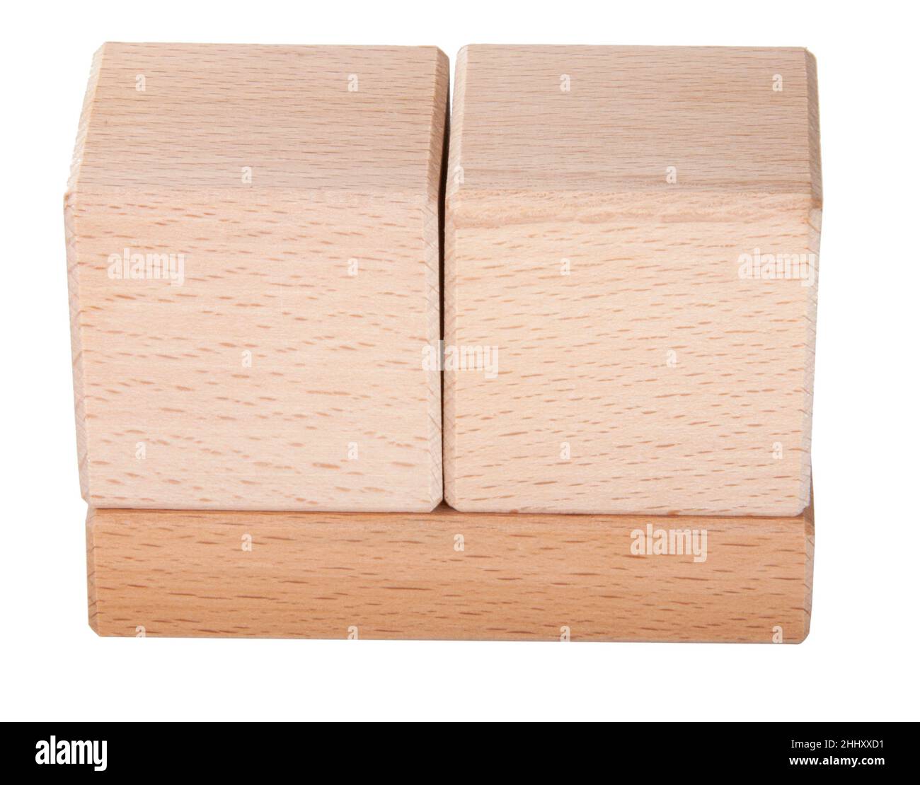 two wooden cubes on one brick create construction isolated on the white ...
