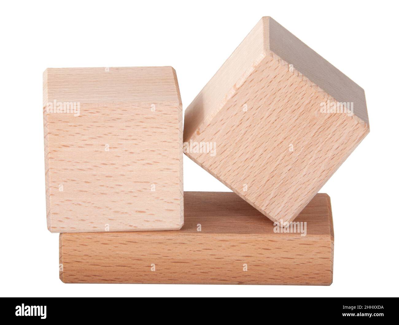 two wooden cubes on one brick create construction isolated on the white ...