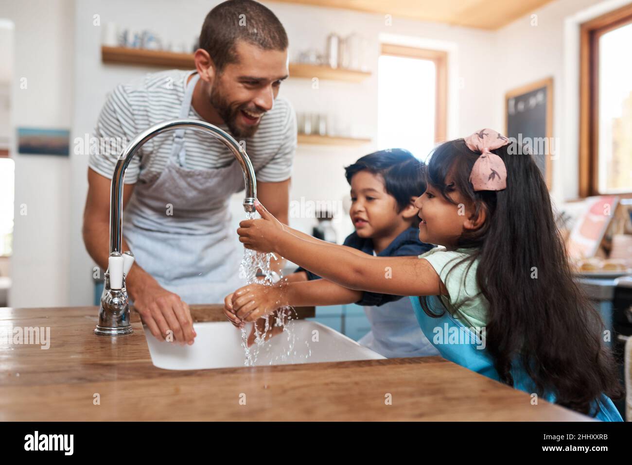 Boy rinsing hands in sink hi-res stock photography and images - Alamy