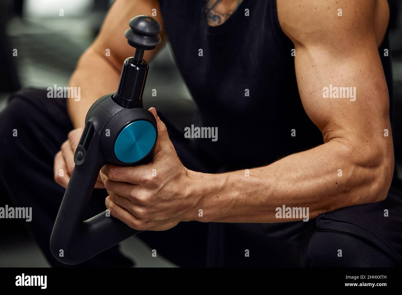 How to use a massage gun for recovery hi-res stock photography and ...