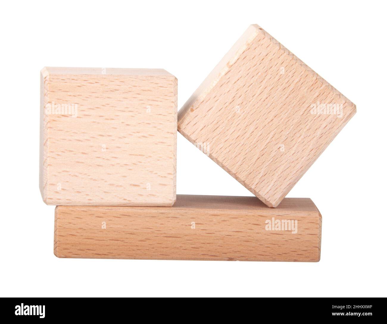 two wooden cubes on one brick create construction isolated on the white ...
