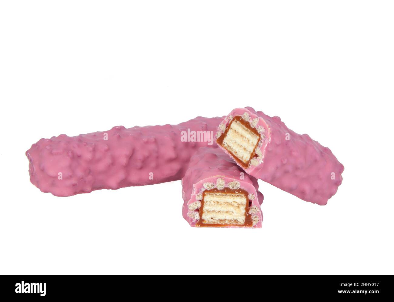 Pink chocolate crispy brocken bar with wildberry taste isolated on the ...