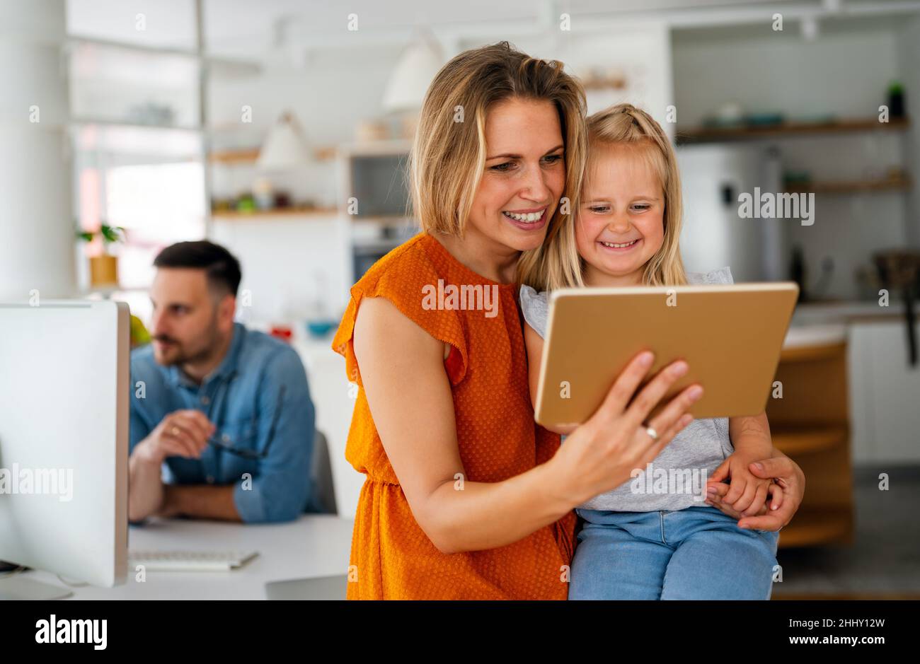 Device technology family online education concept. Happy family with ...