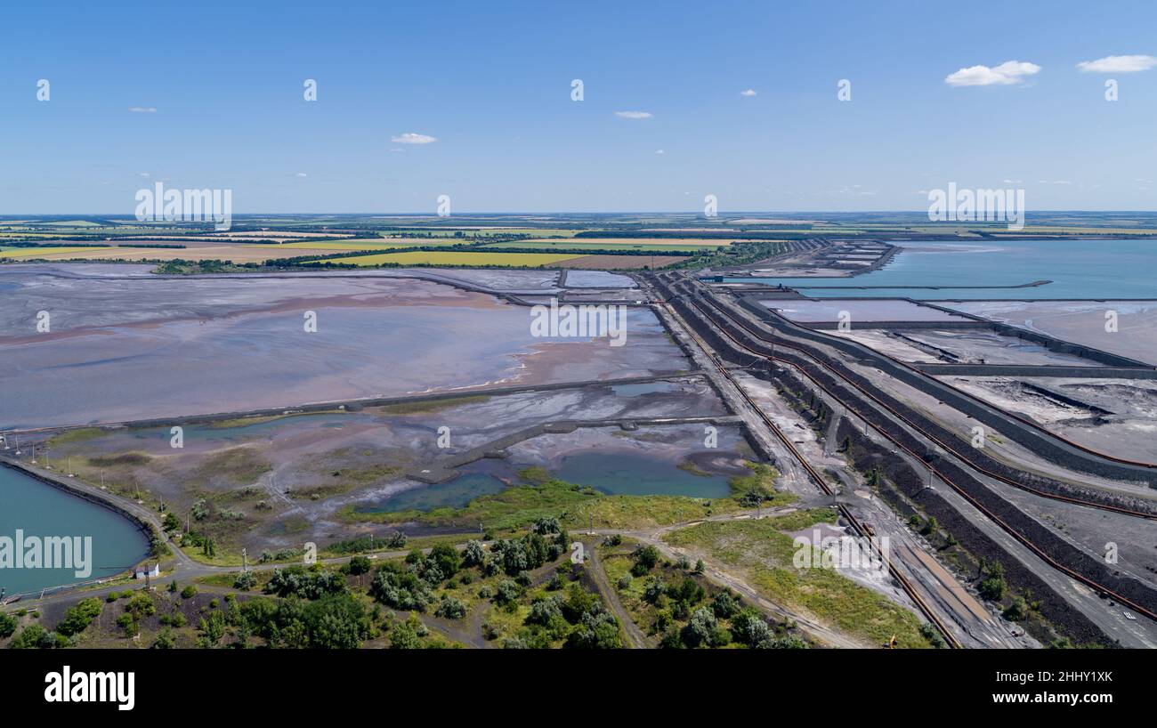 Tailing dump in industrial city aerial view Stock Photo - Alamy