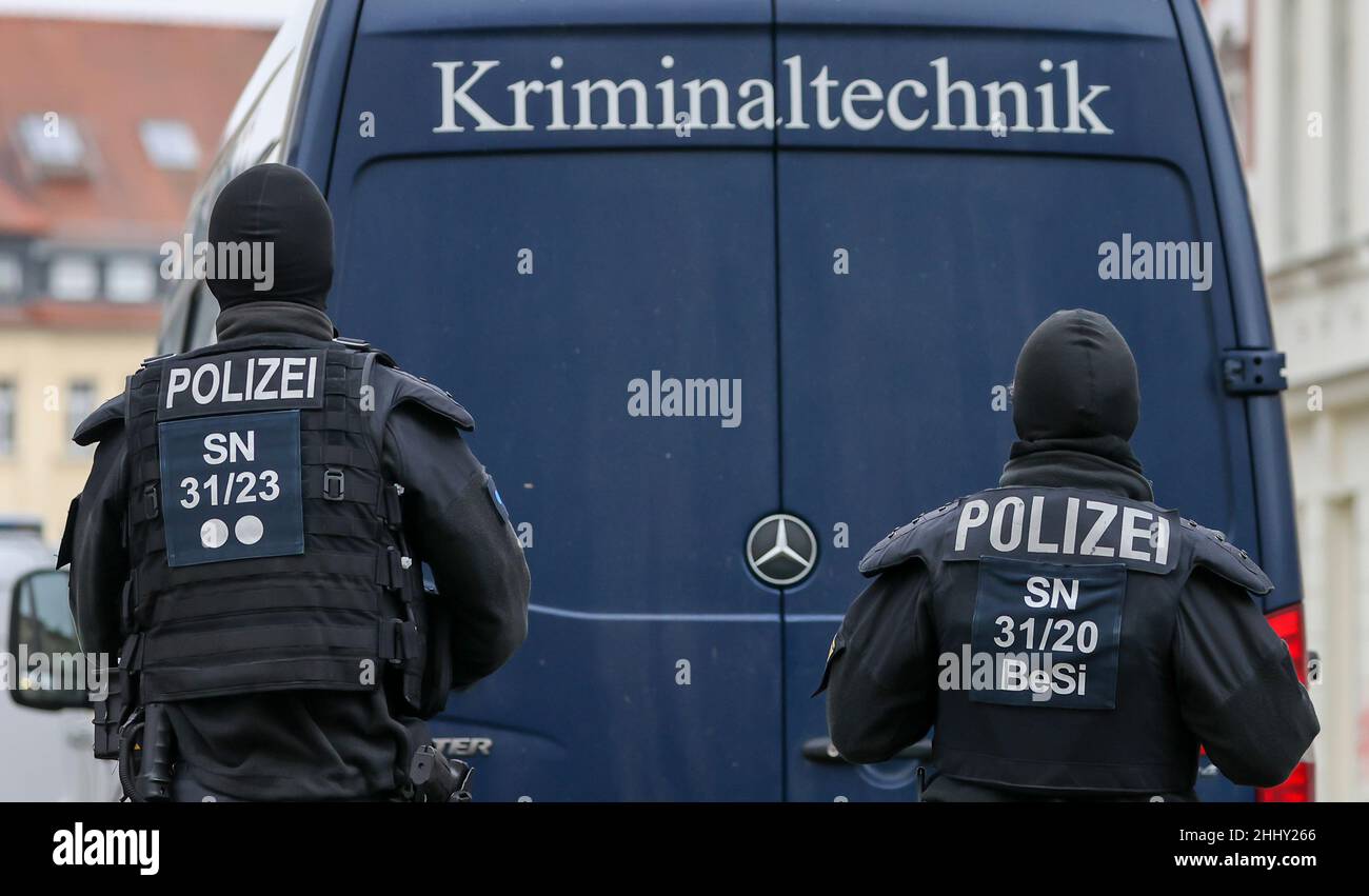 Leipzig, Germany. 26th Jan, 2022. Police officers stand during searches ...