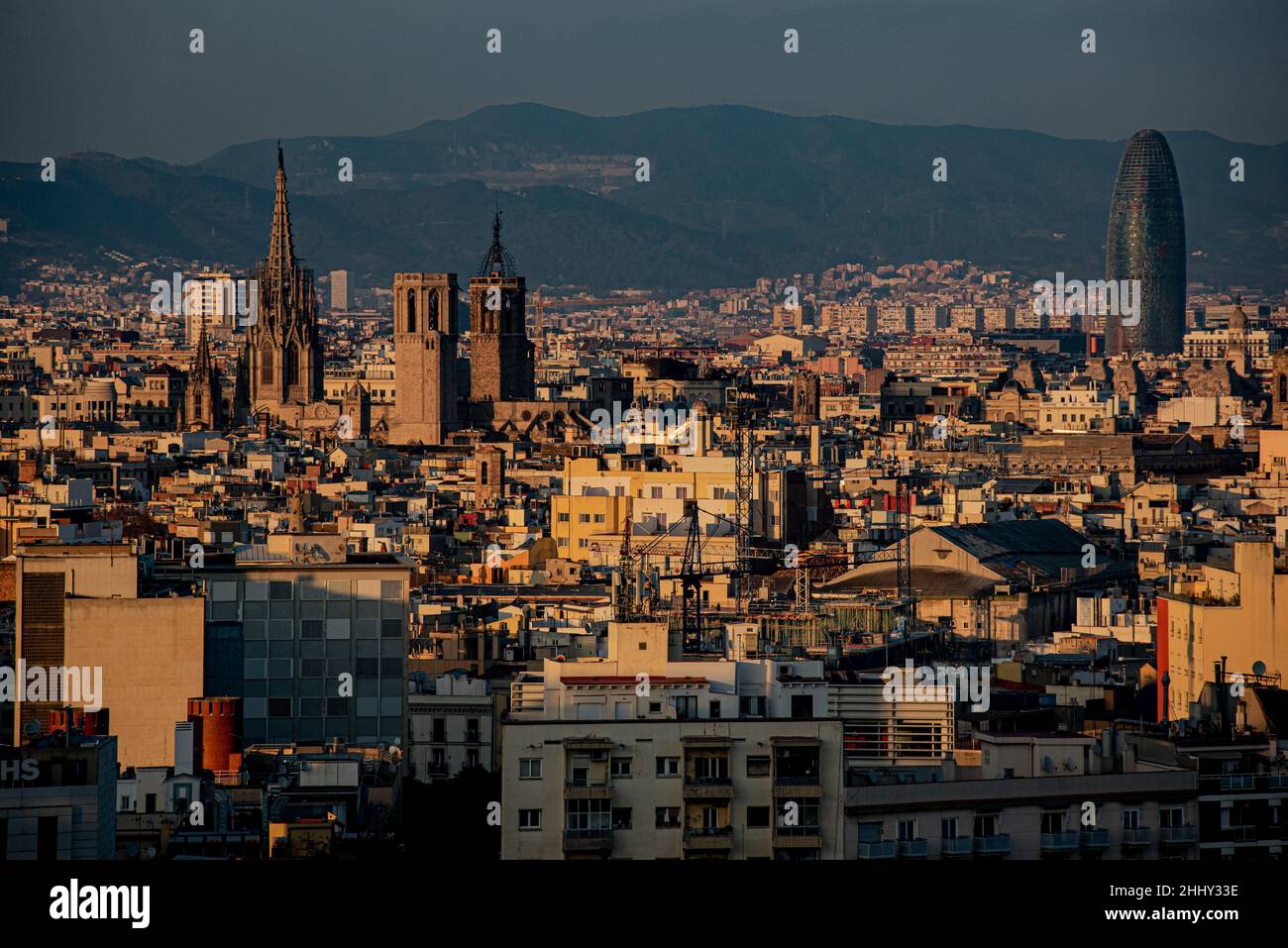 Barcelona cathedral and Agbar tower emerges among the buildings of the ...