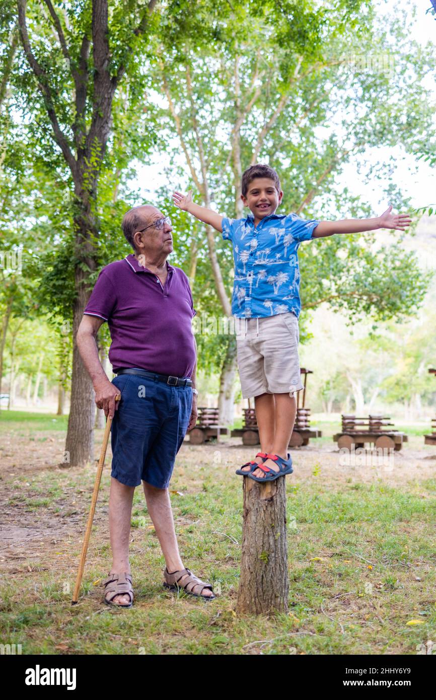 Grandfather and his grandson playing in the forest Stock Photo - Alamy